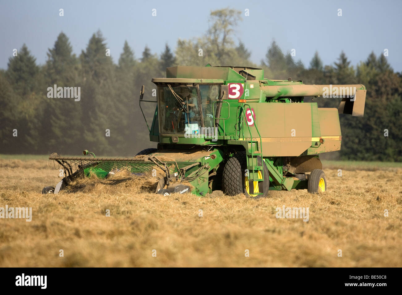 Agriculture tractors making hay bales hi-res stock photography and ...
