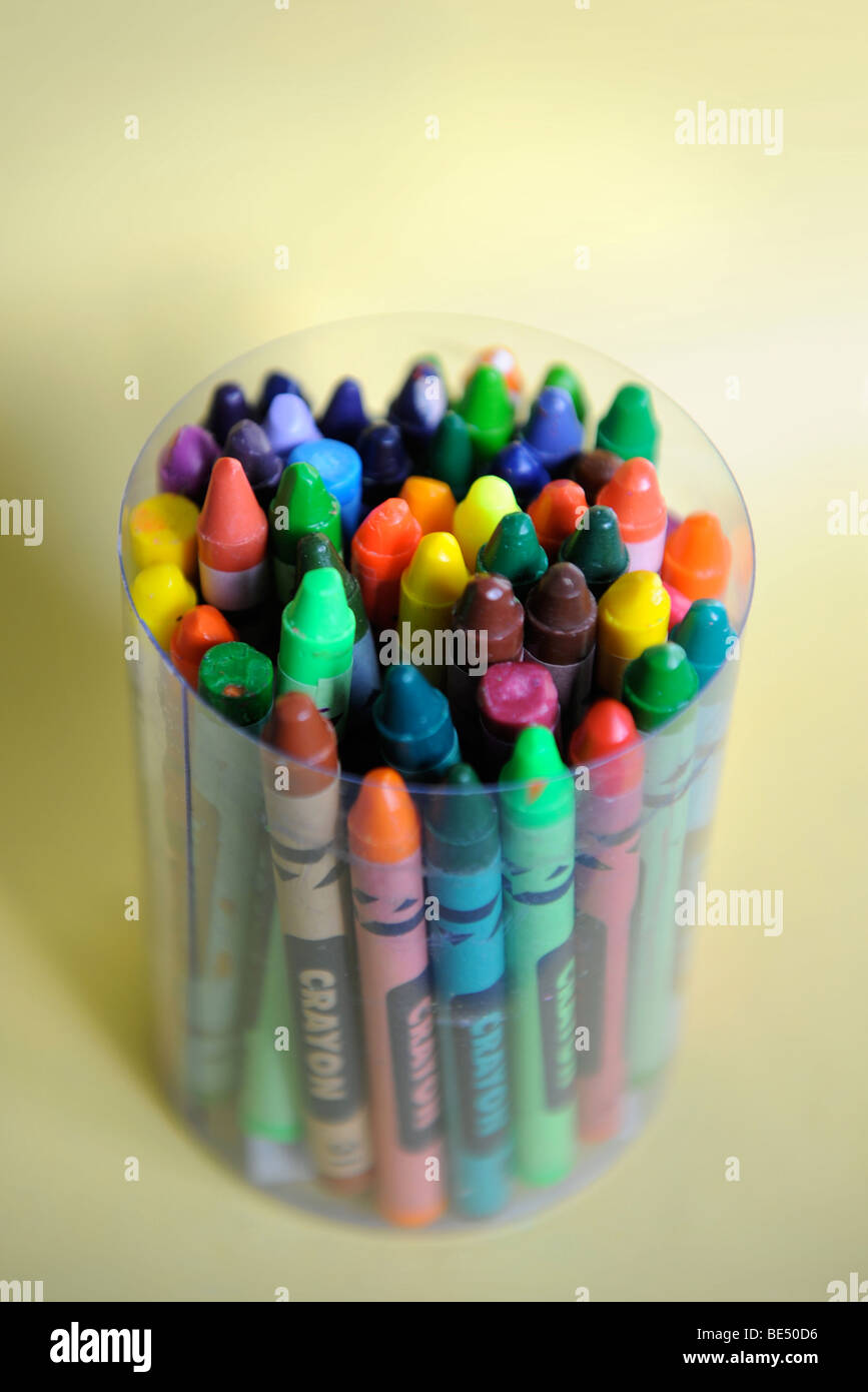 A COLLECTION OF COLOURED CHILDRENS CRAYONS WITH HOLY BIBLE AT A SUNDAY ...