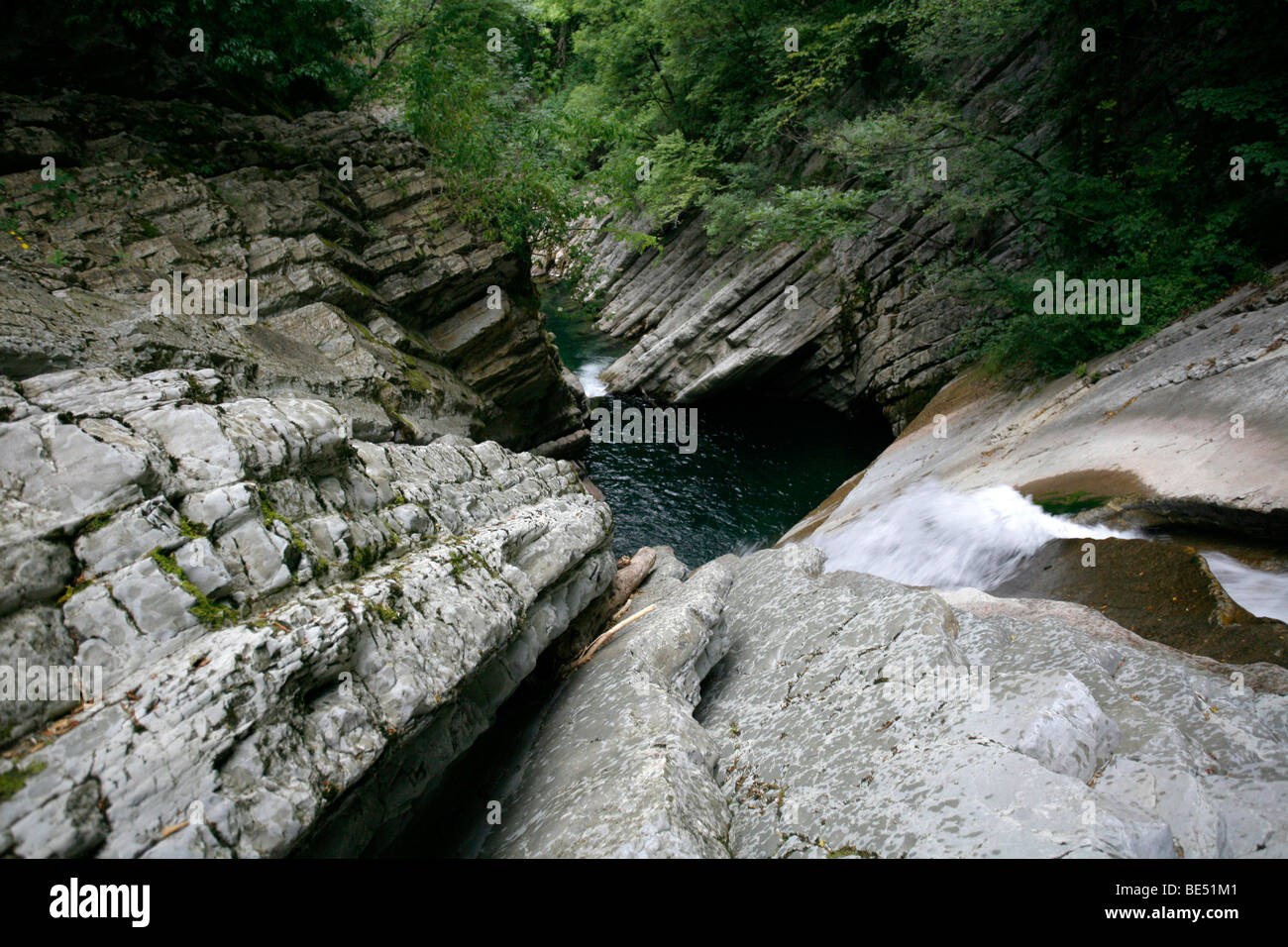 Raindrops falling on bands of limestone eroded by the Breggia River ...