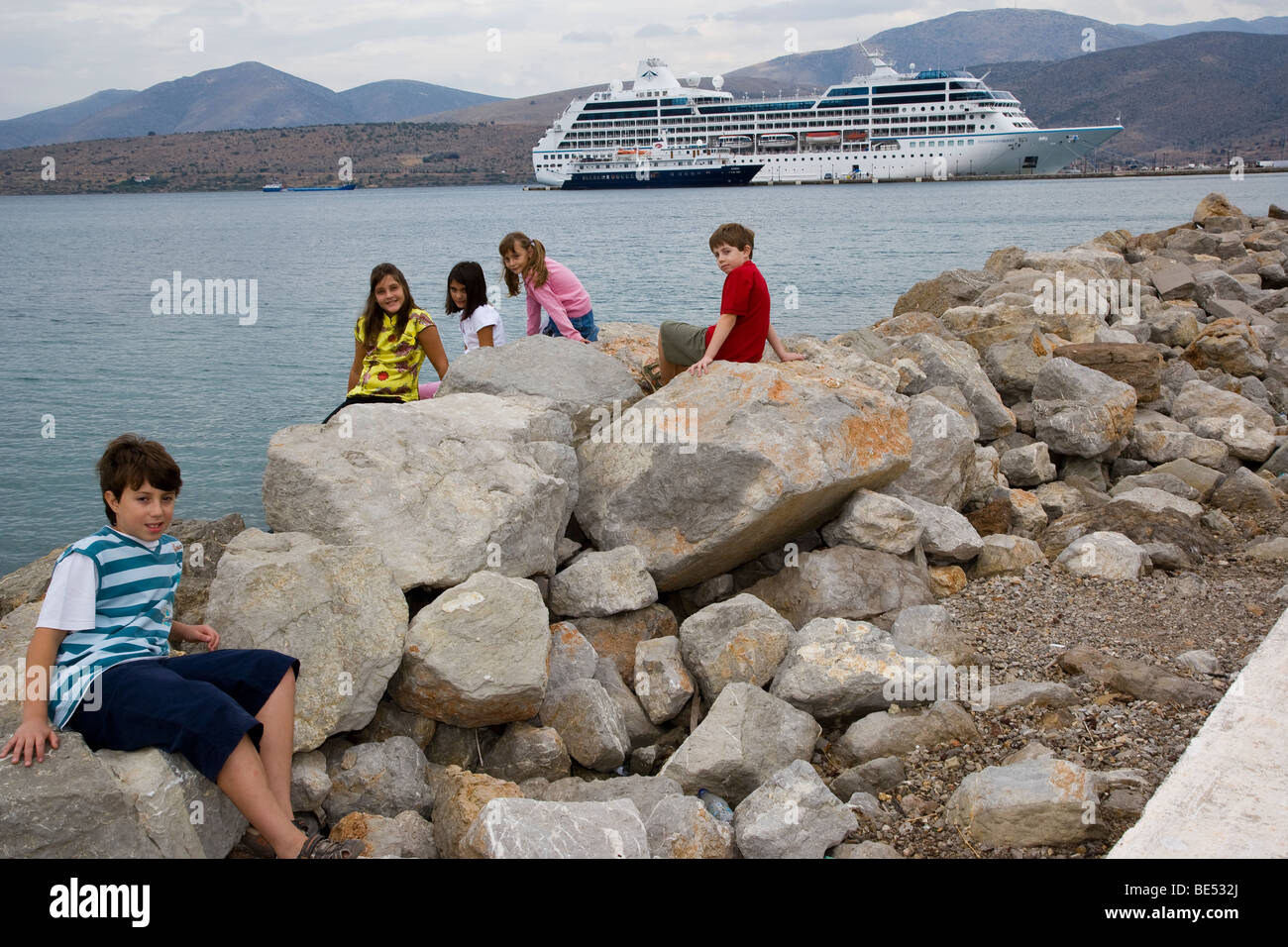 Children Playing on the rocks by the sea Stock Photo - Alamy