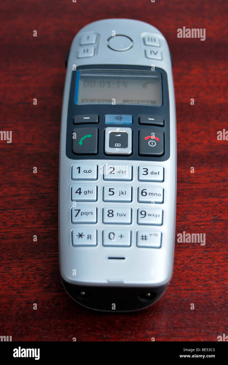 Cordless phone keypad with extra large buttons on a desk made of ...