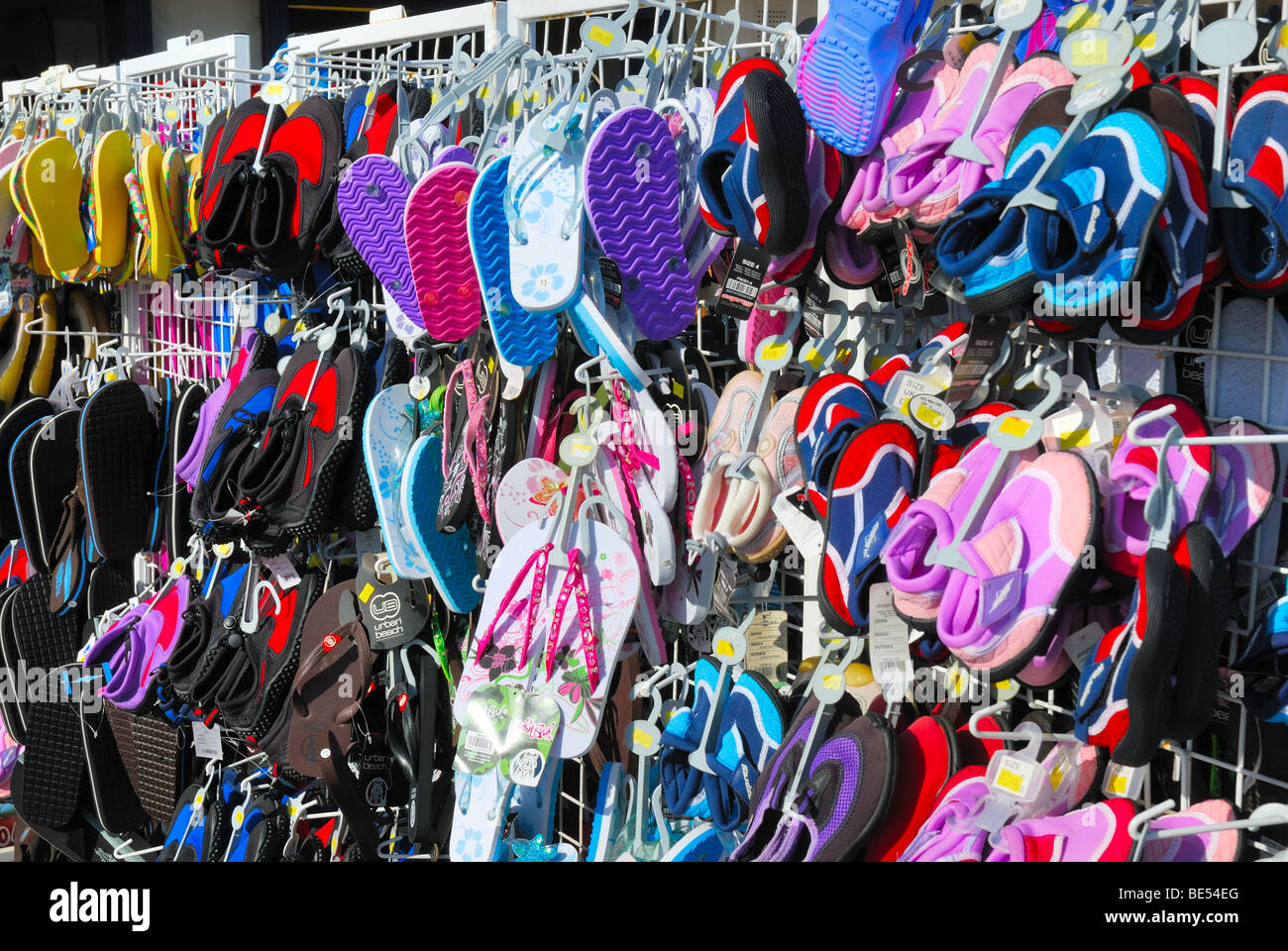 Beach shoes on shop rack Stock Photo - Alamy