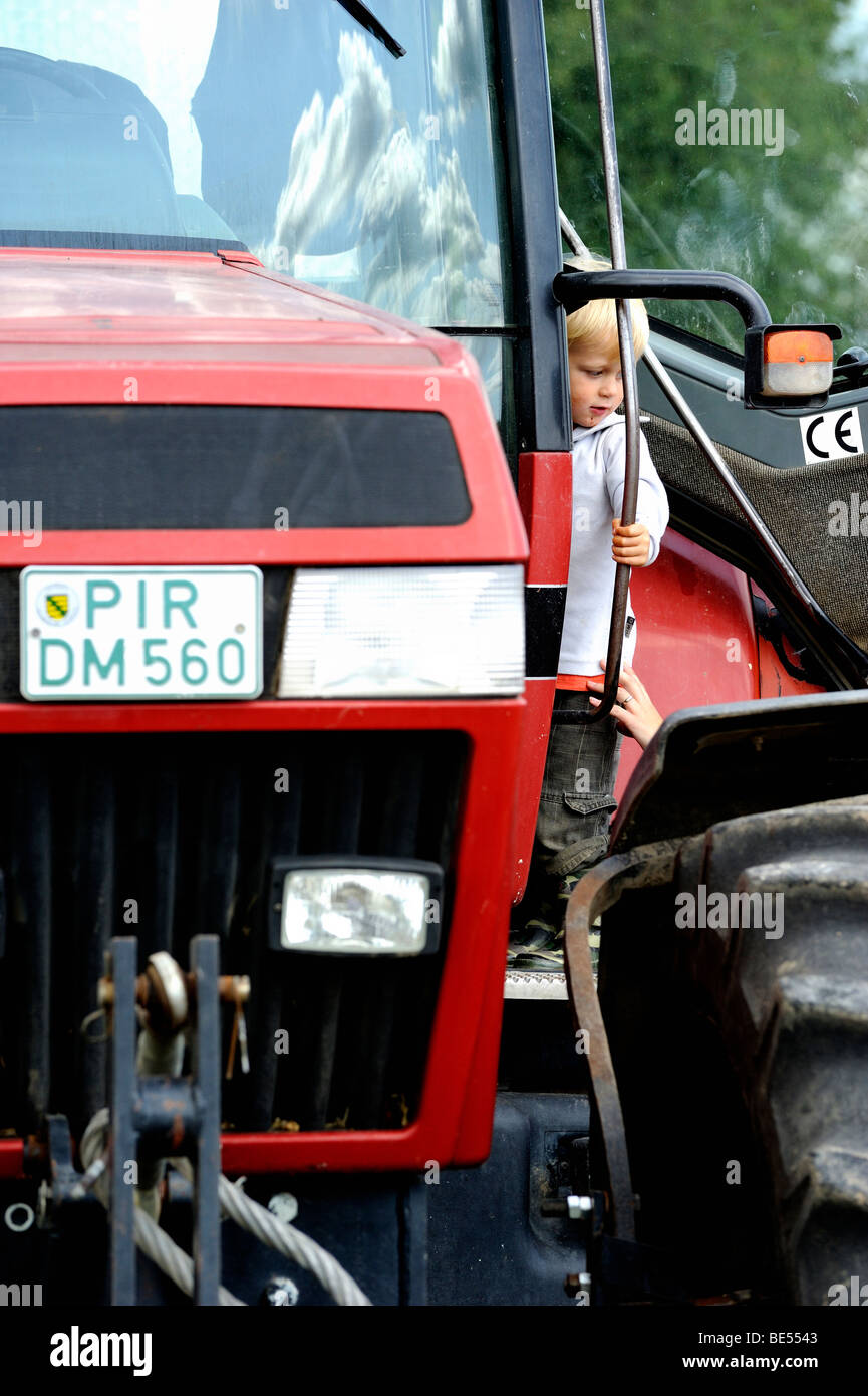 Child driving an agricultural vehicle hi-res stock photography and ...