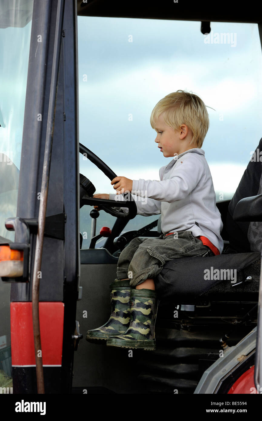 Child driving an agricultural vehicle hi-res stock photography and ...