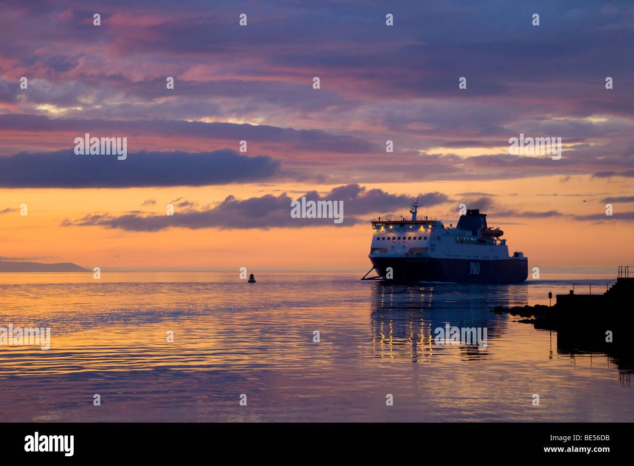 Passenger Ferry entering Larne Harbour at sunset Stock Photo - Alamy
