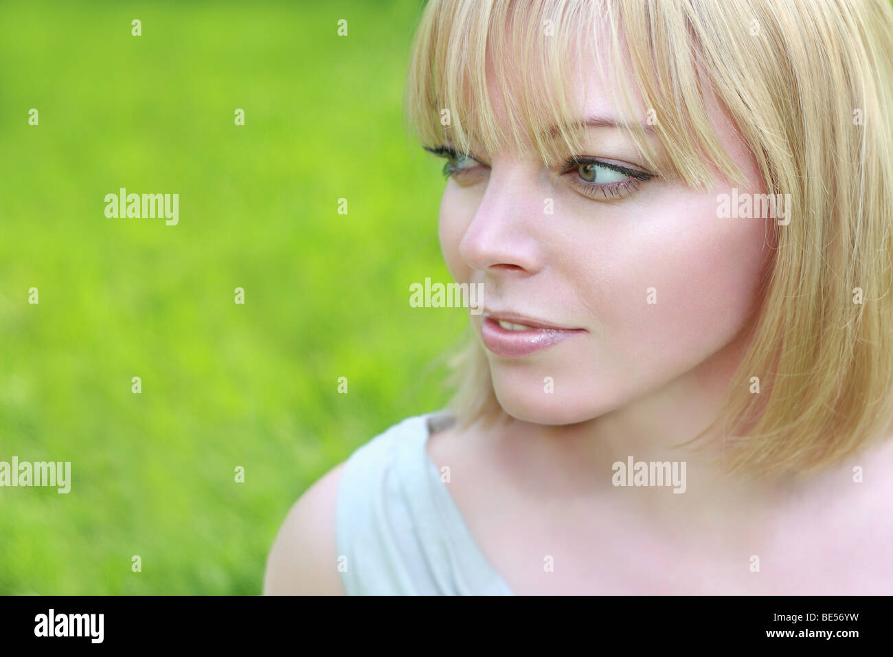 Portrait of pretty relaxing woman outdoor Stock Photo - Alamy