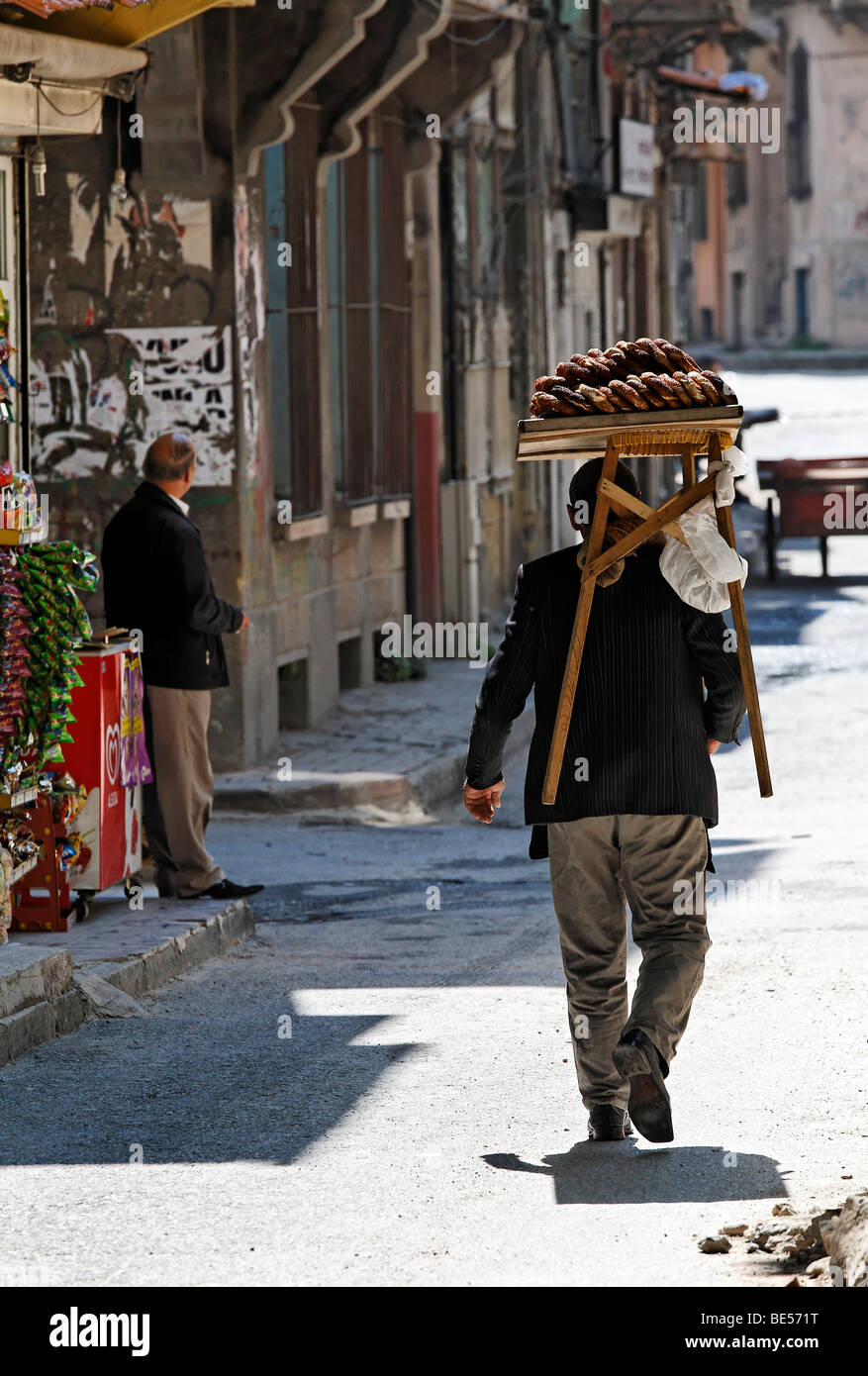 Man carrying wooden sales table with simit on his shoulder, selling ...