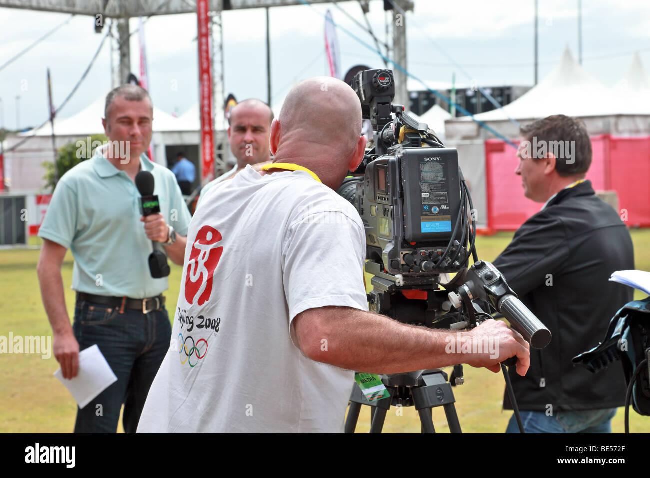 TV Cameraman taking stock footage of a beach Stock Photo - Alamy