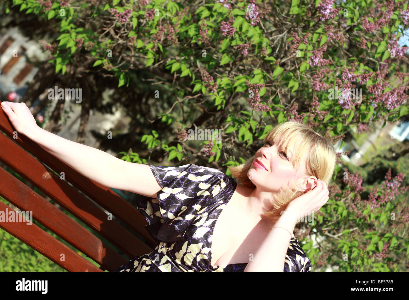 Portrait of pretty relaxing woman outdoor Stock Photo - Alamy