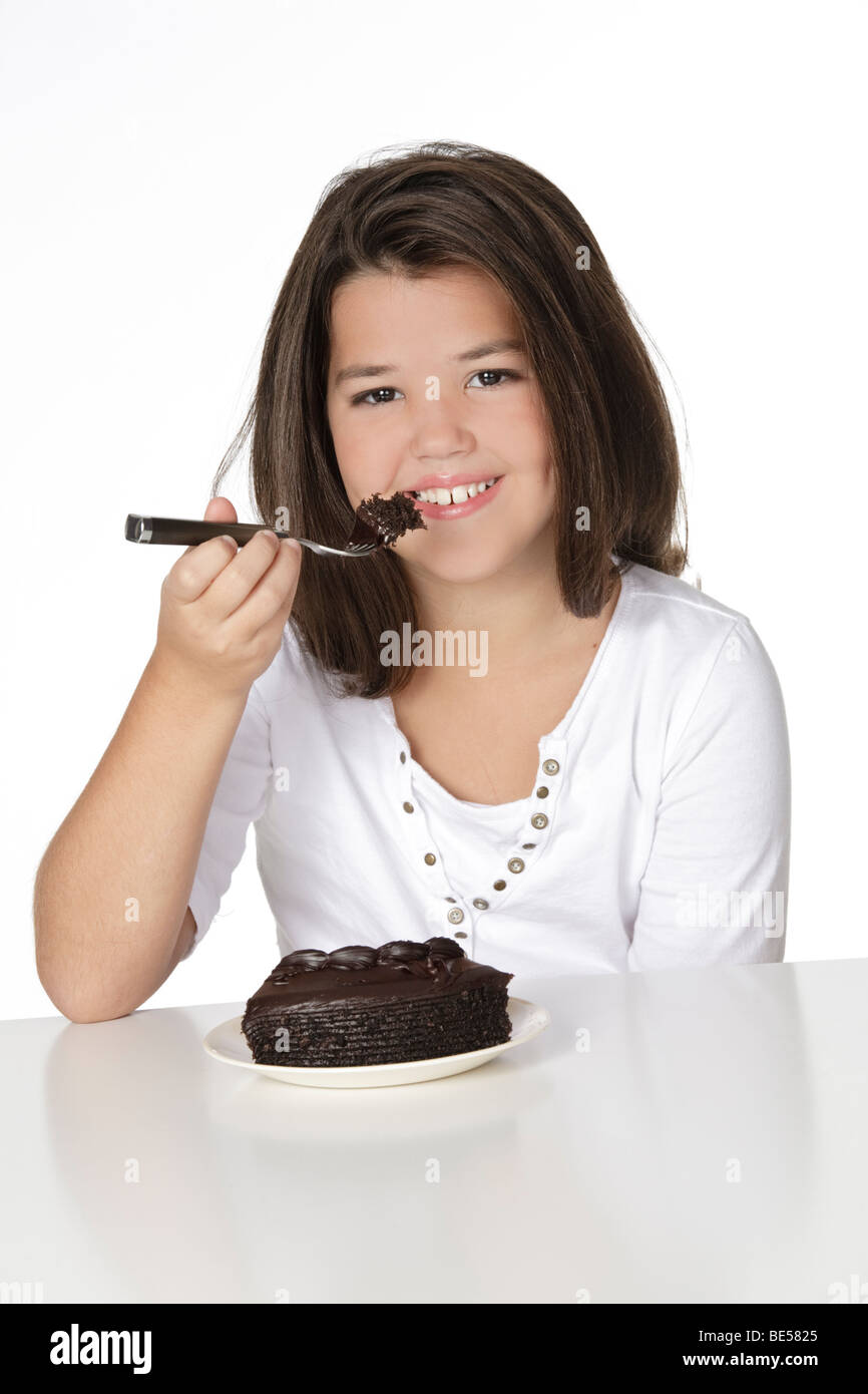Cute Caucasian child eating a slice of chocolate cake Stock Photo - Alamy