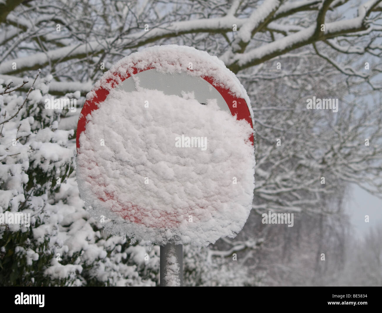 Snow covered road sign Stock Photo - Alamy