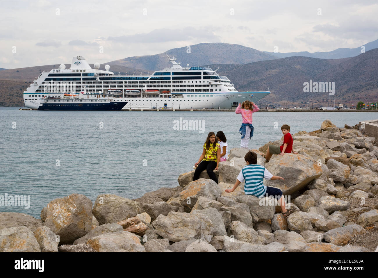Children Playing on the rocks by the sea Stock Photo - Alamy