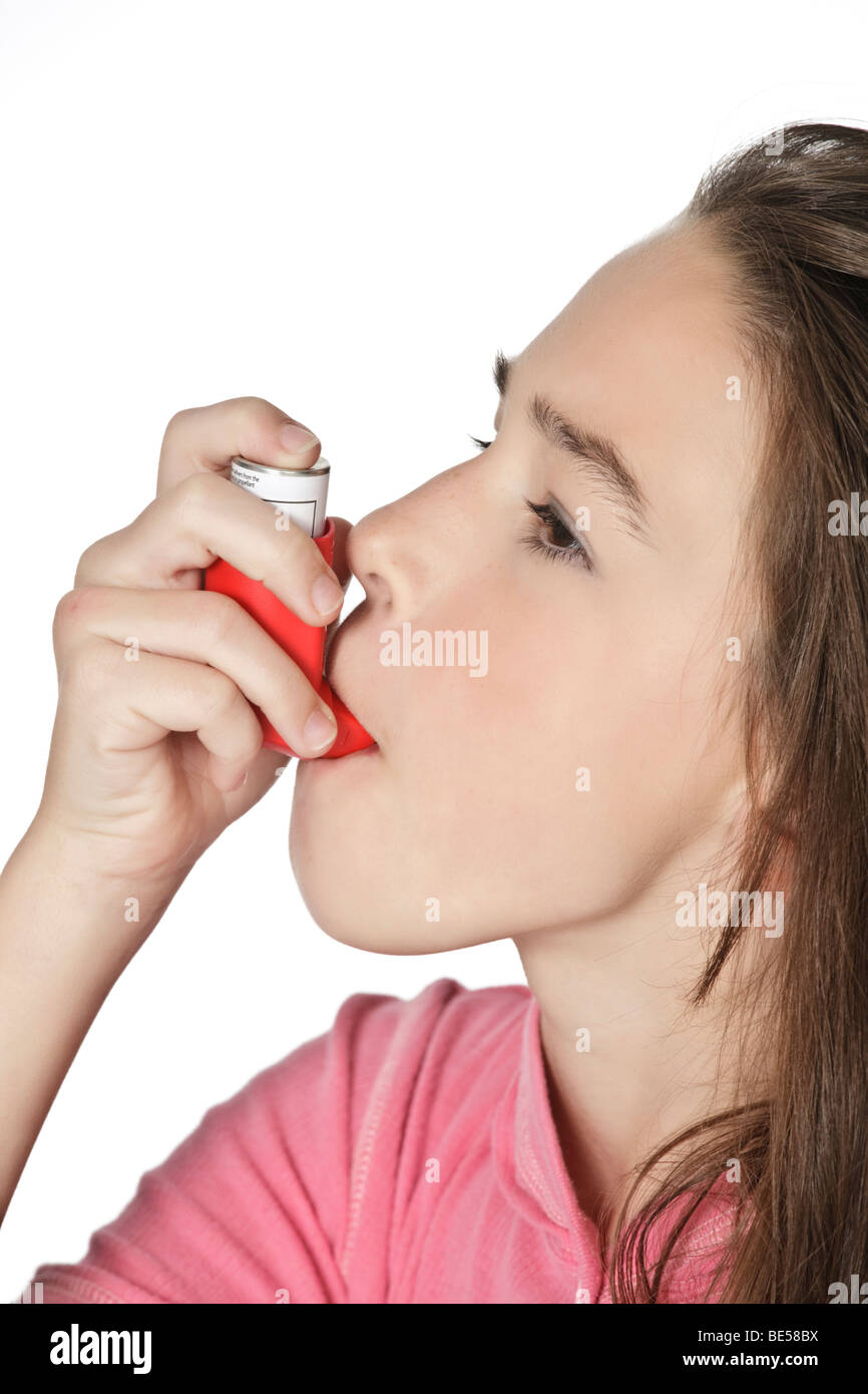 Cute Caucasian girl using an inhaler for Asthma Stock Photo - Alamy