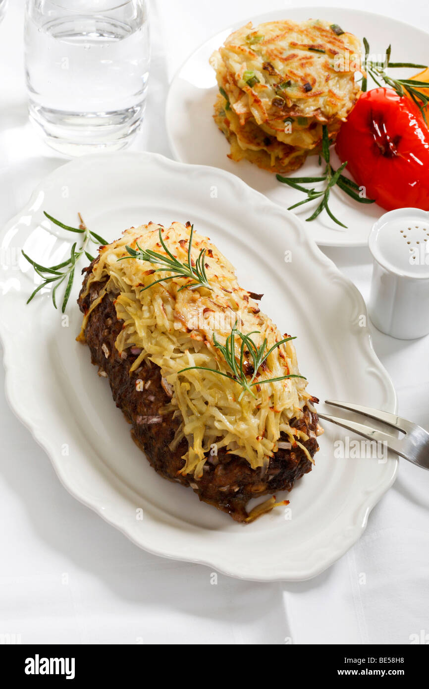 Meatloaf with hash browns and sautéed peppers Stock Photo - Alamy