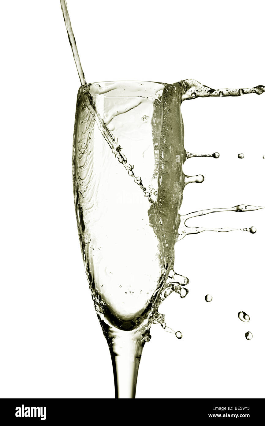 champagne flowing from a glass Stock Photo - Alamy