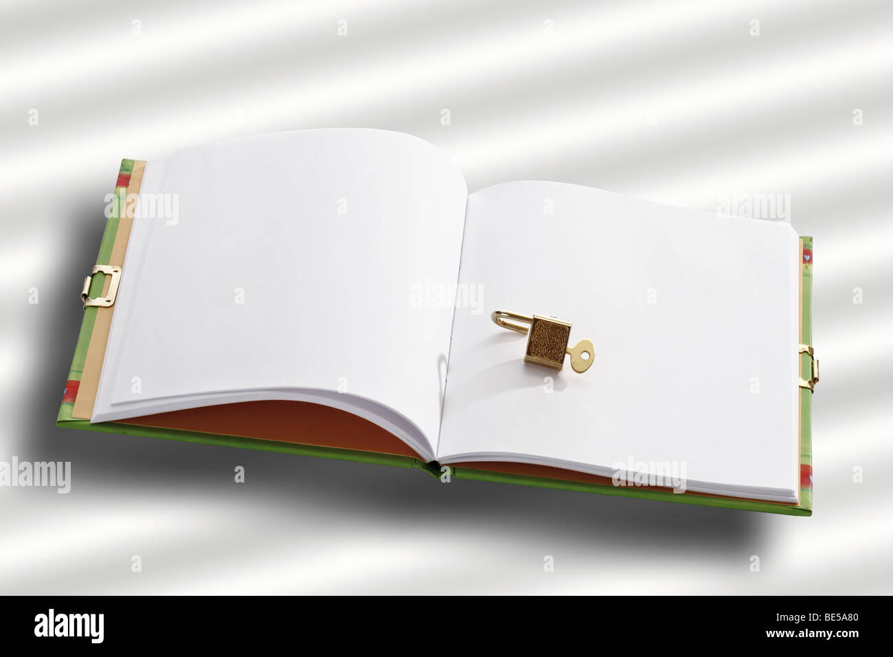 Open diary with a small padlock Stock Photo - Alamy