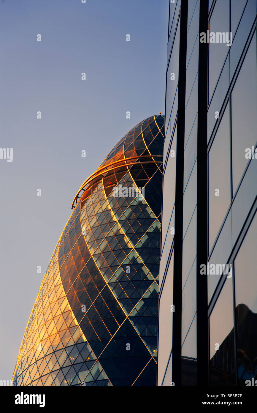 Sir Norman Foster Building against skyscraper City London England ...