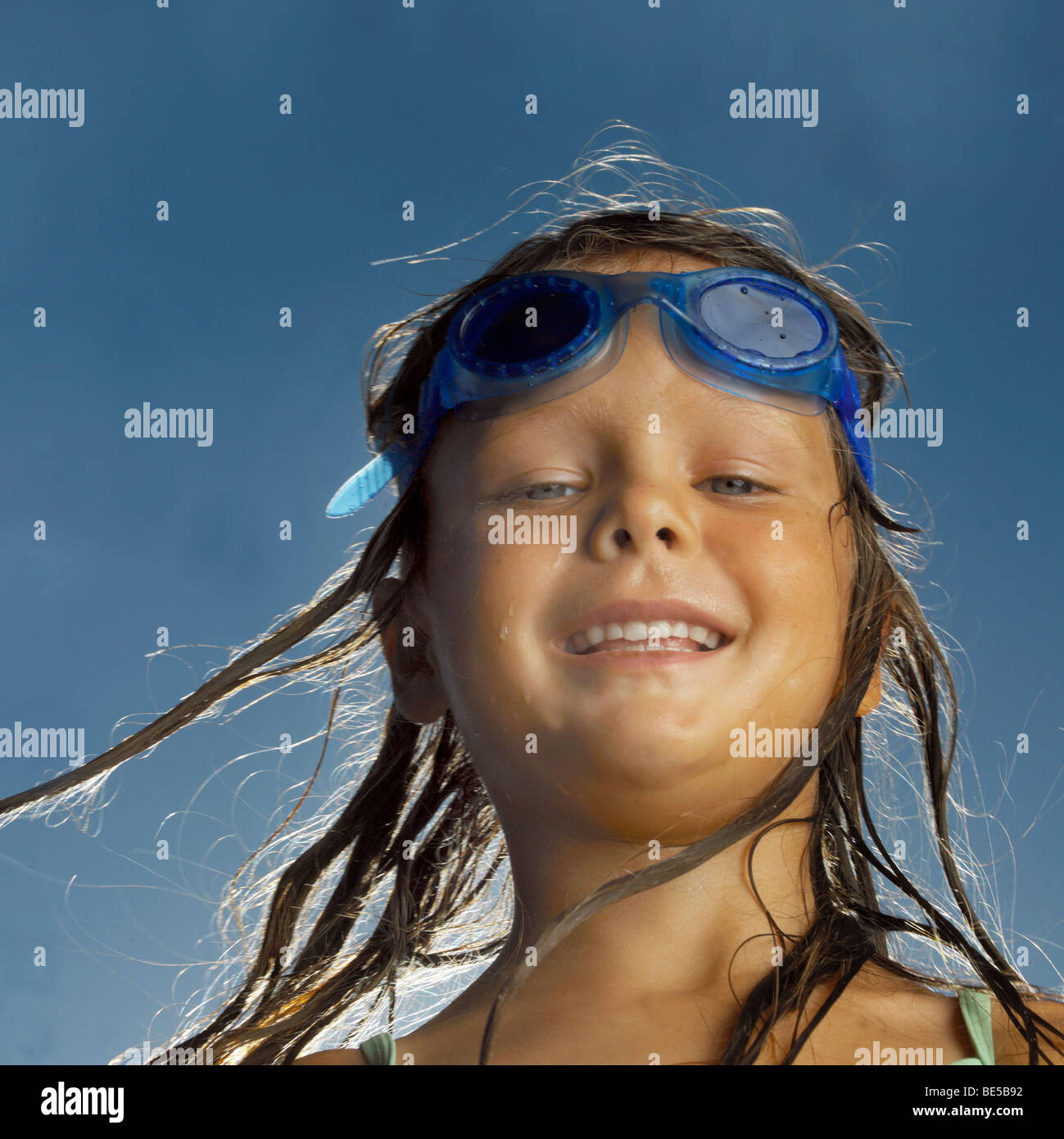 young girl wearing blue goggles Stock Photo - Alamy