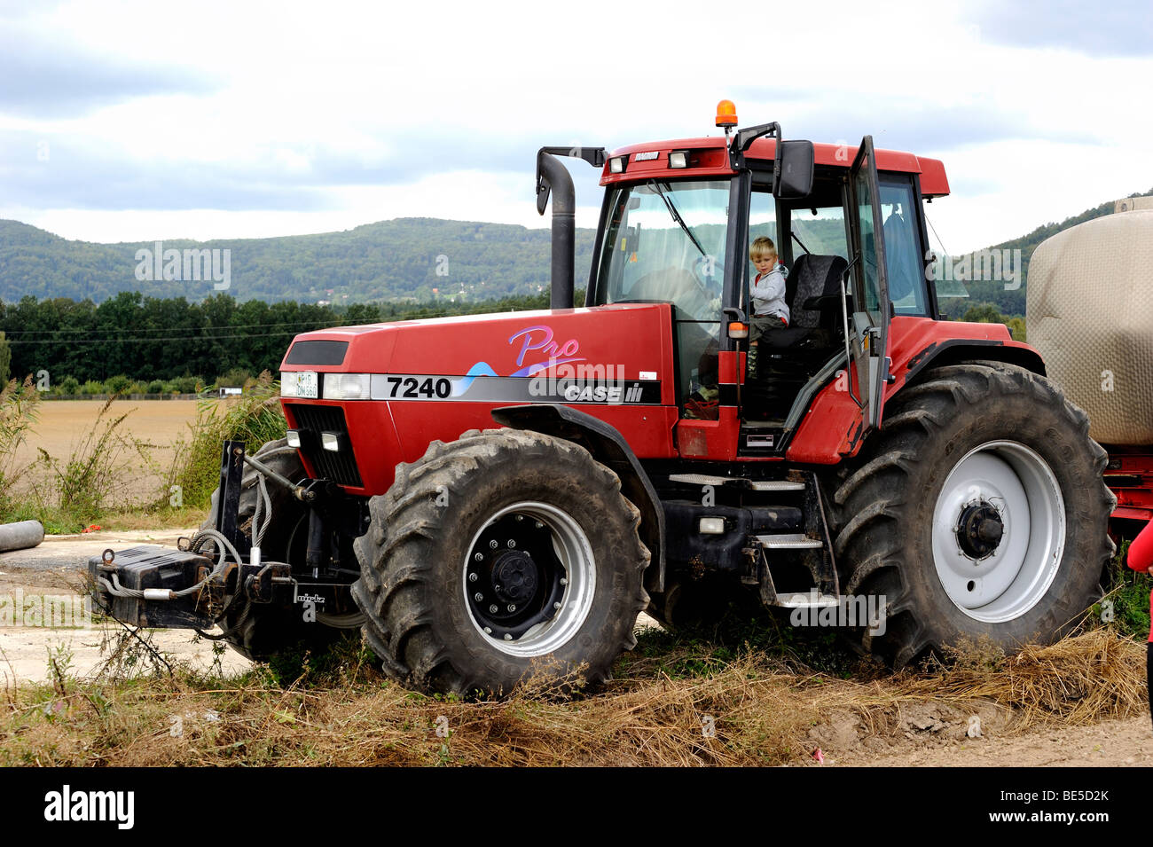 Child driving an agricultural vehicle hi-res stock photography and ...