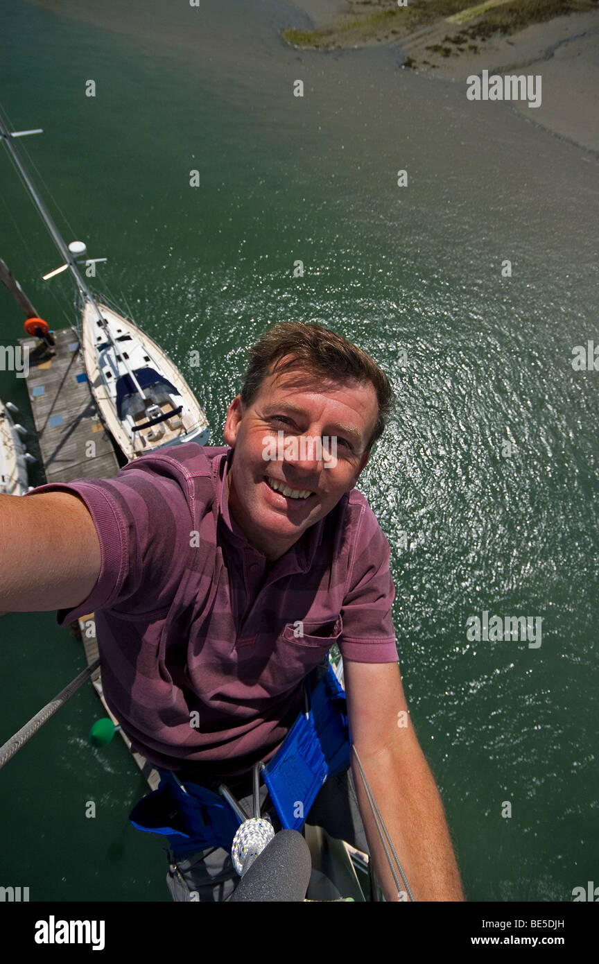 Neil Foster at the top of a Southerly 35 mast Stock Photo - Alamy