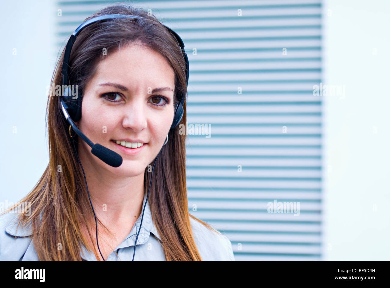 Sales Woman with headset phone Stock Photo - Alamy