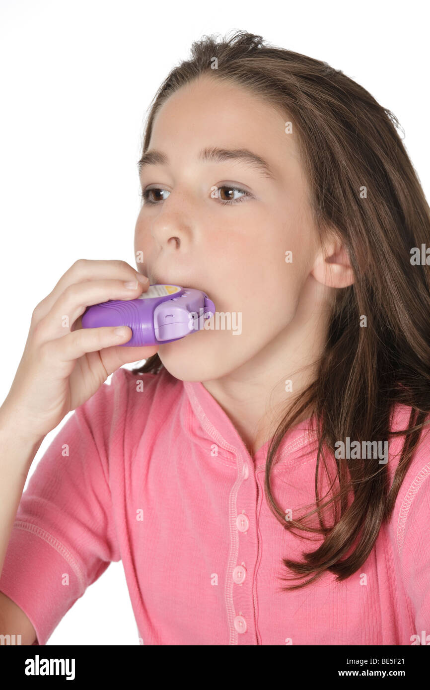Cute Caucasian girl using an inhaler for Asthma Stock Photo - Alamy