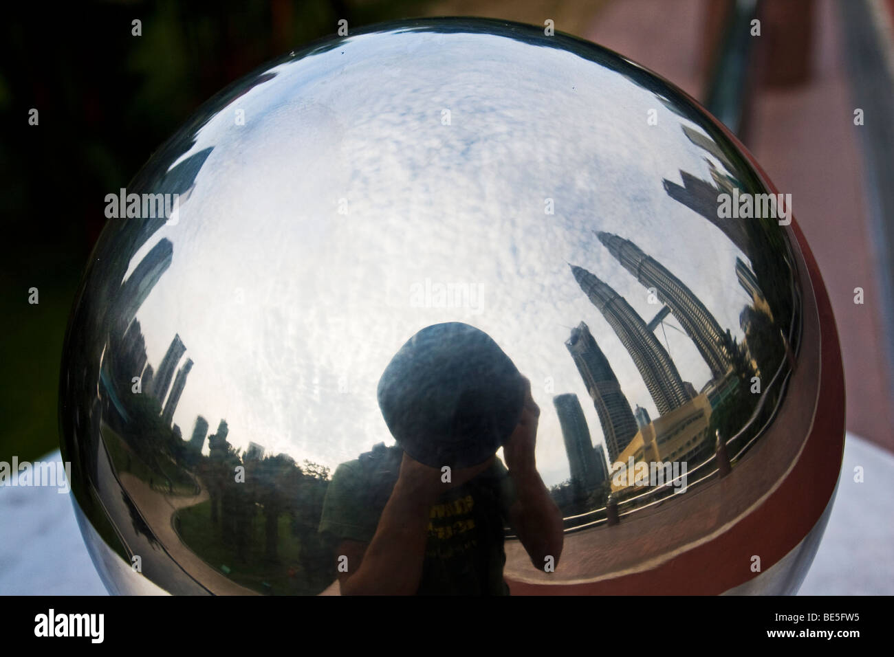 Photographer reflected in a mirror sphere taking picture to the ...
