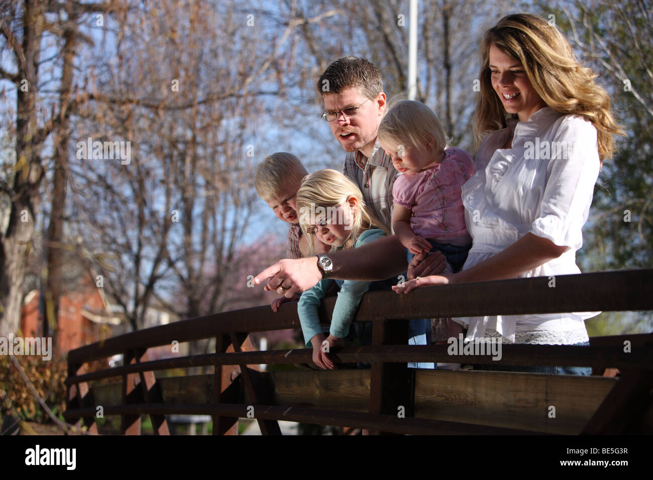 Children looking over bridge hi-res stock photography and images - Alamy