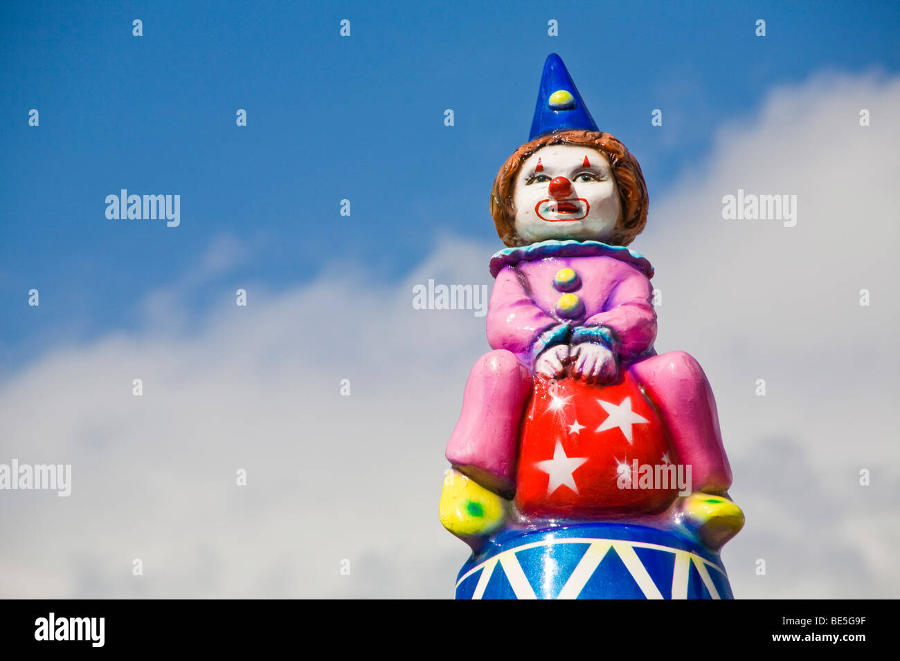 Colorful clown figure against the sky Stock Photo - Alamy