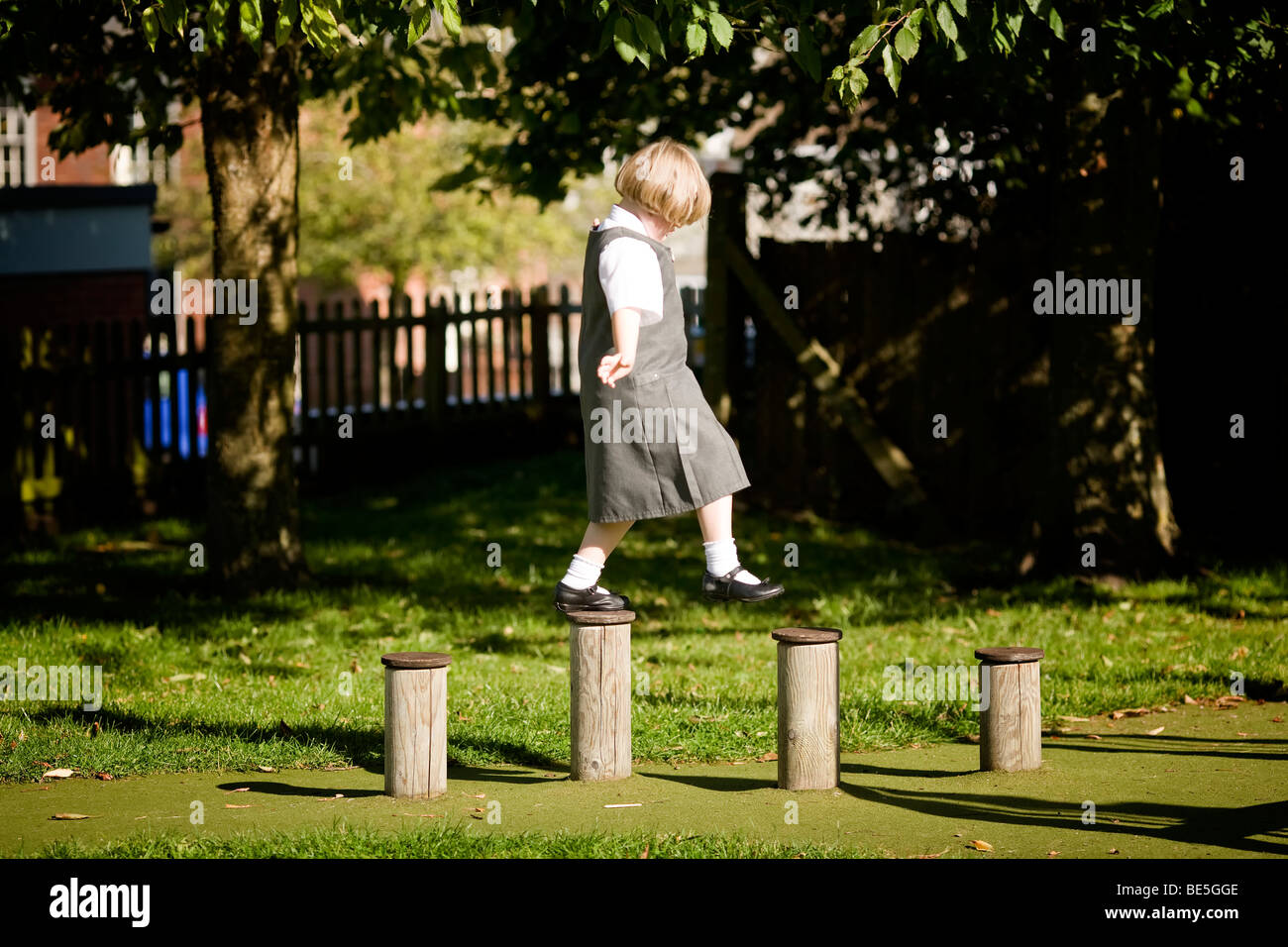 girl walking across obstacle course Stock Photo - Alamy