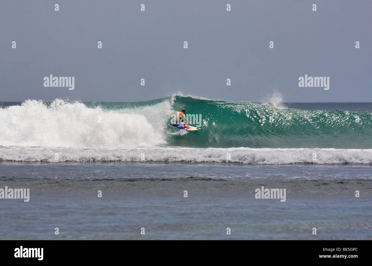 Surfing Indonesia. Surfer inside a barrel in Bingin. Bali, Indonesia ...
