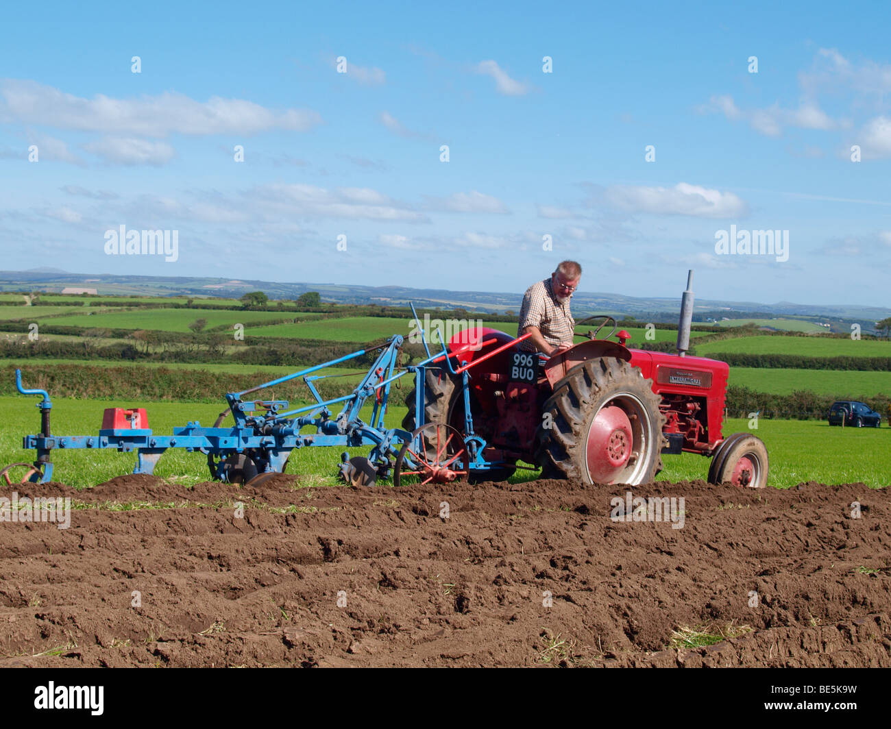 Vintage tractor and plough Stock Photo - Alamy