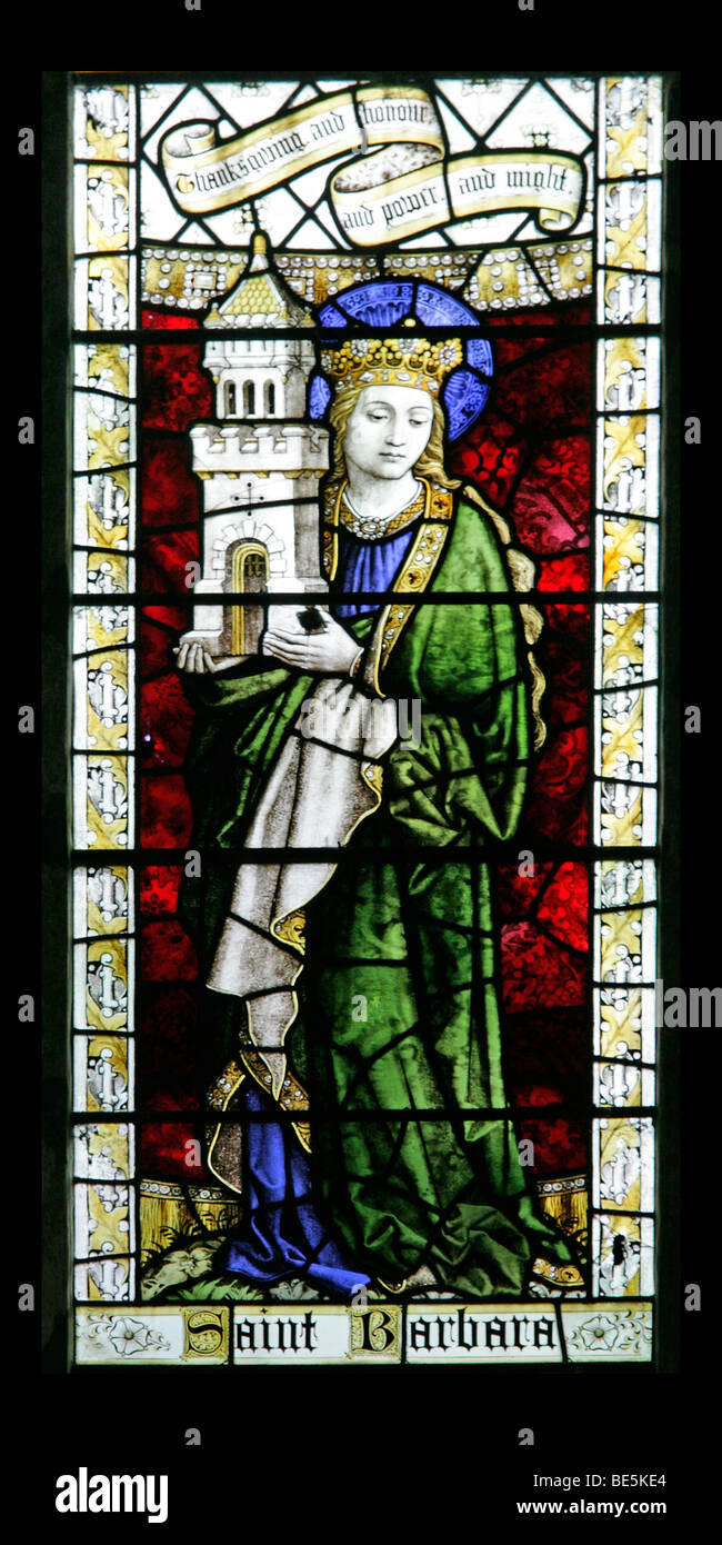 A Stained Glass Window Depicting Saint Barbara holding her symbol, a ...