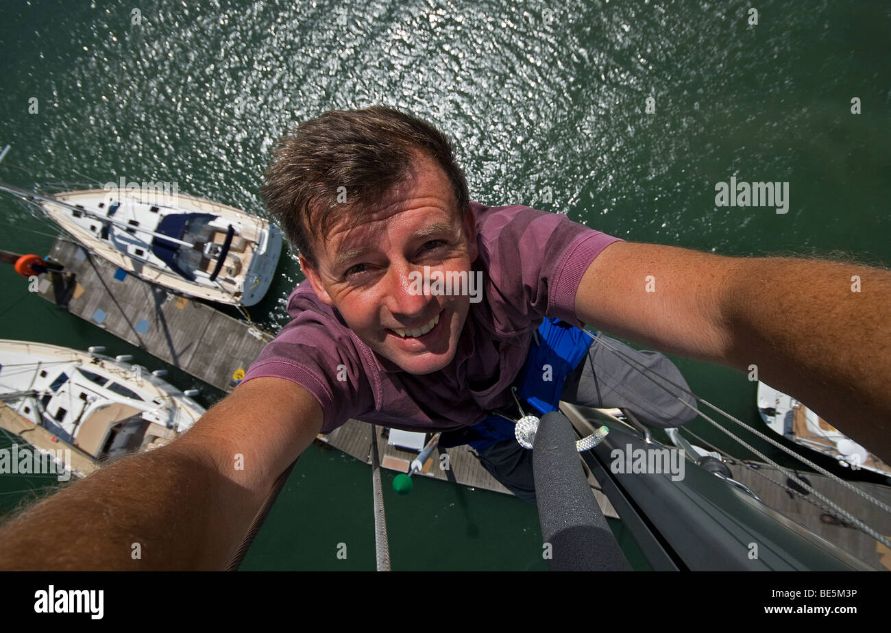 Neil Foster at the top of a Southerly 35 mast Stock Photo - Alamy
