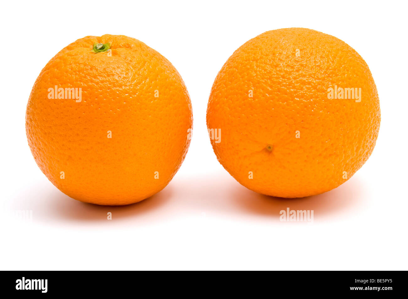 Two perfect whole oranges isolated on white background Stock Photo - Alamy