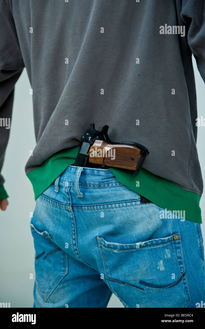 Hiding a gun hi-res stock photography and images - Alamy