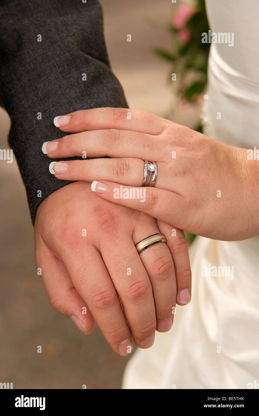 wedding rings on hands, just married Stock Photo - Alamy