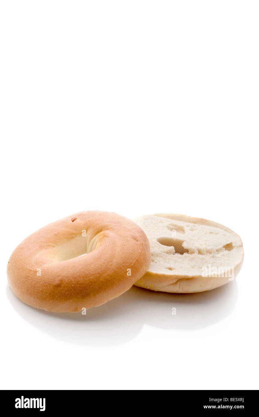 A sliced bagel on a white reflective background Stock Photo - Alamy