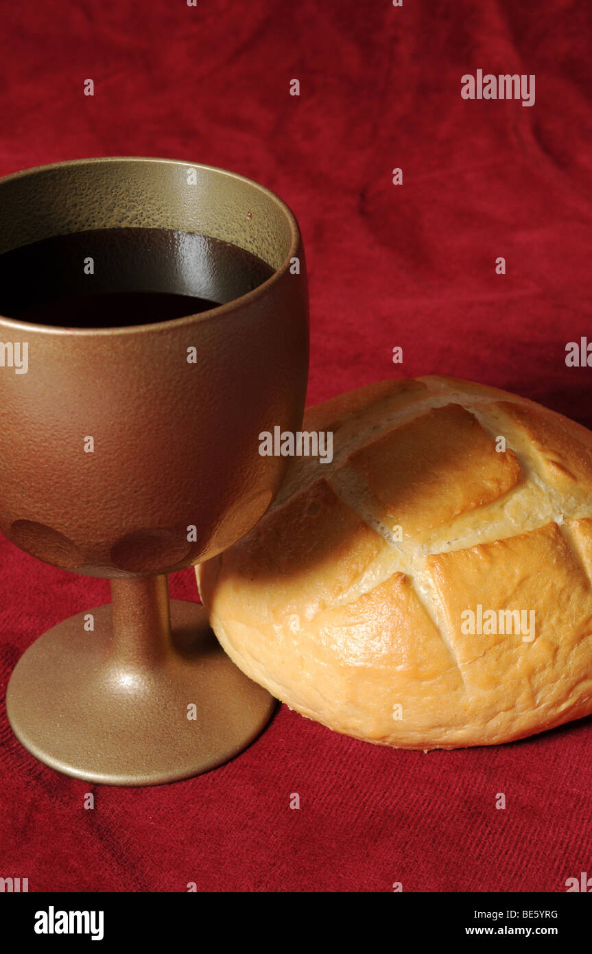 Communion elements close up over a red background Stock Photo - Alamy