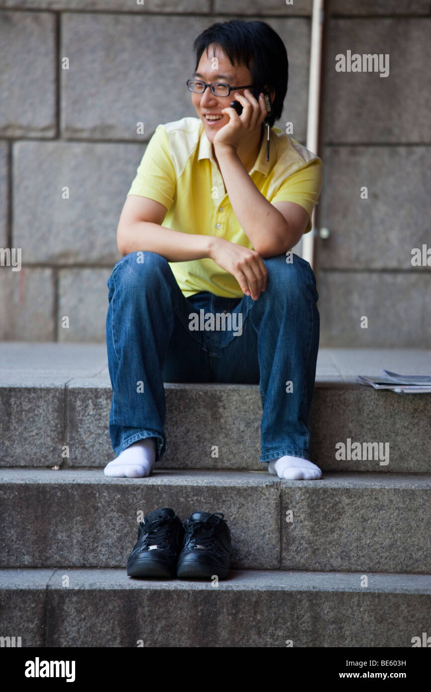 Young Korean Man Talking on a Cellphone at Cheonggyecheon River in ...