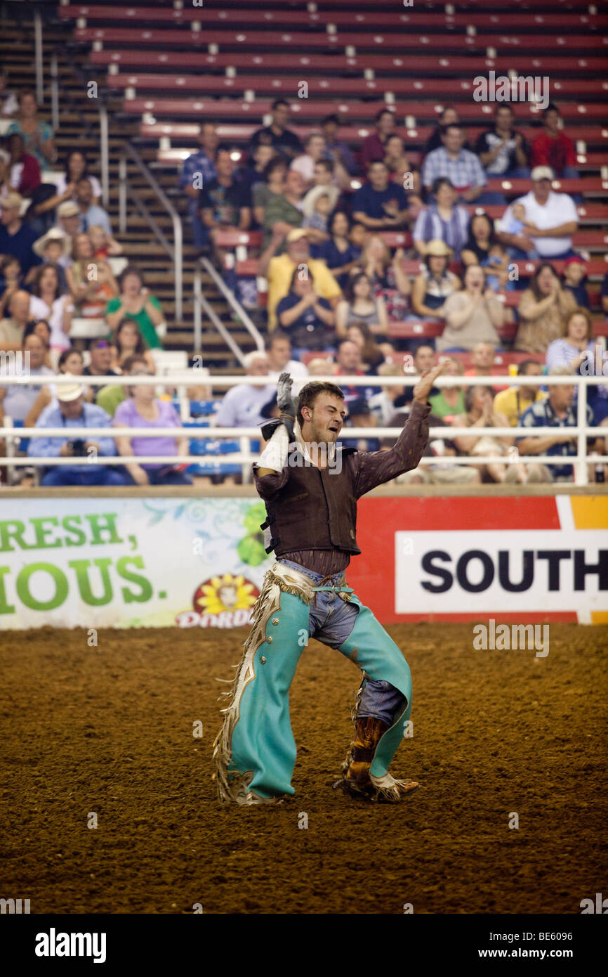 Rodeo Cowboy celebrating his ride in the Mesquite Championship Rodeo ...