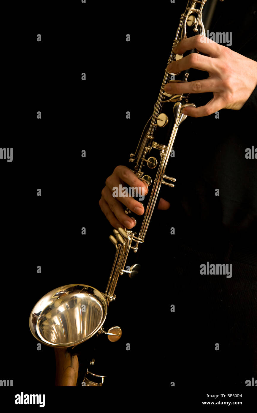 Young musician playing a bass clarinet, detail Stock Photo - Alamy