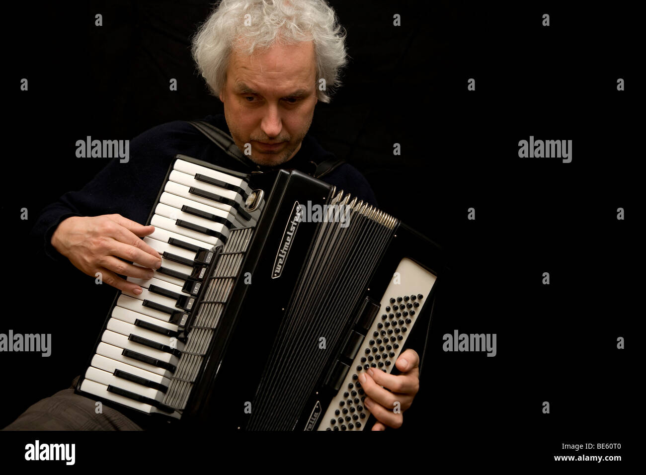Musician playing an accordion Stock Photo - Alamy