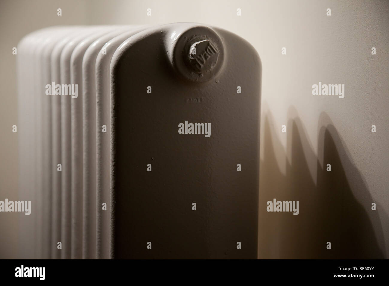 Old-fashioned cast iron radiator Stock Photo - Alamy