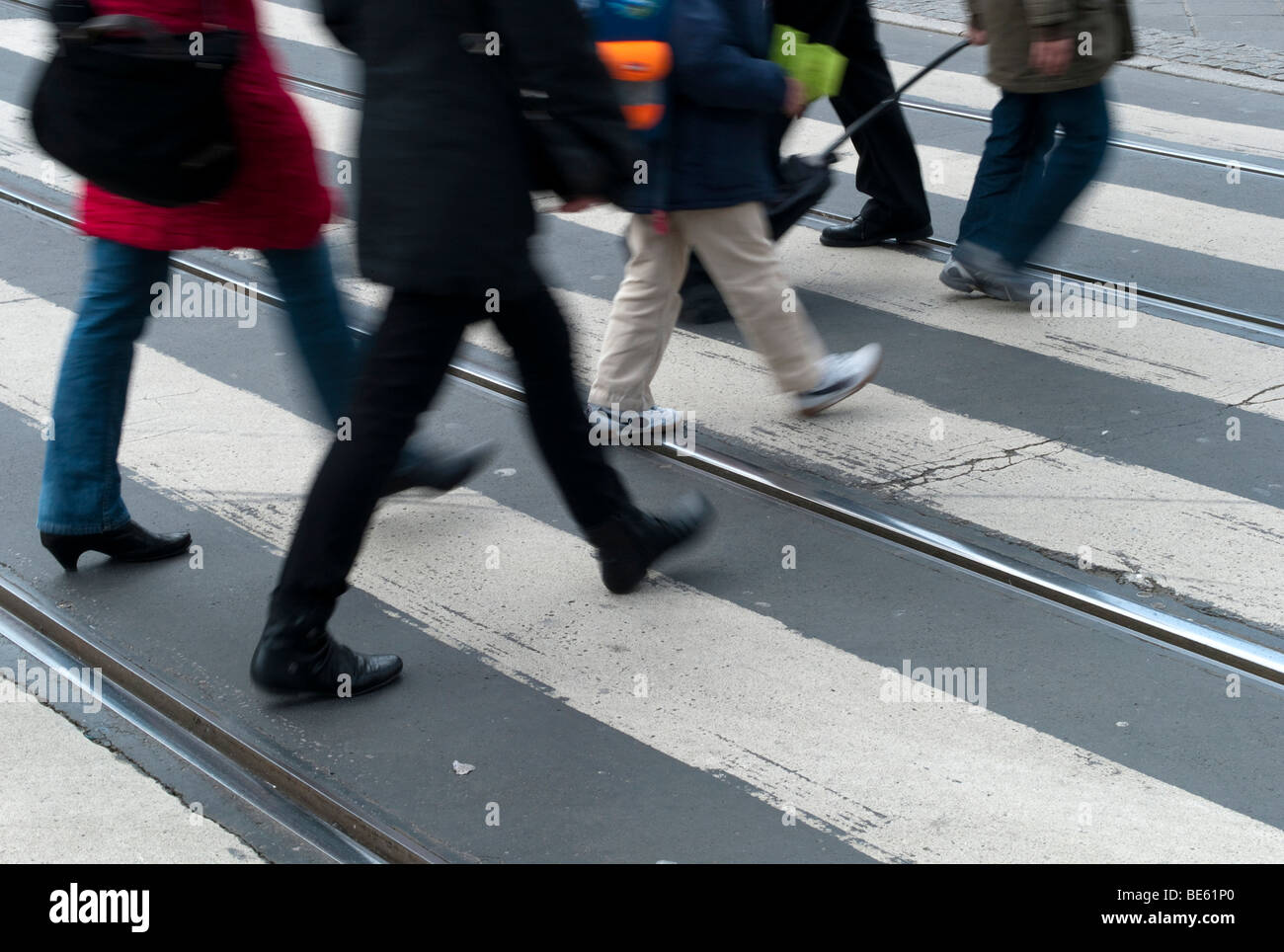 People walking on zebra crossing Stock Photo - Alamy