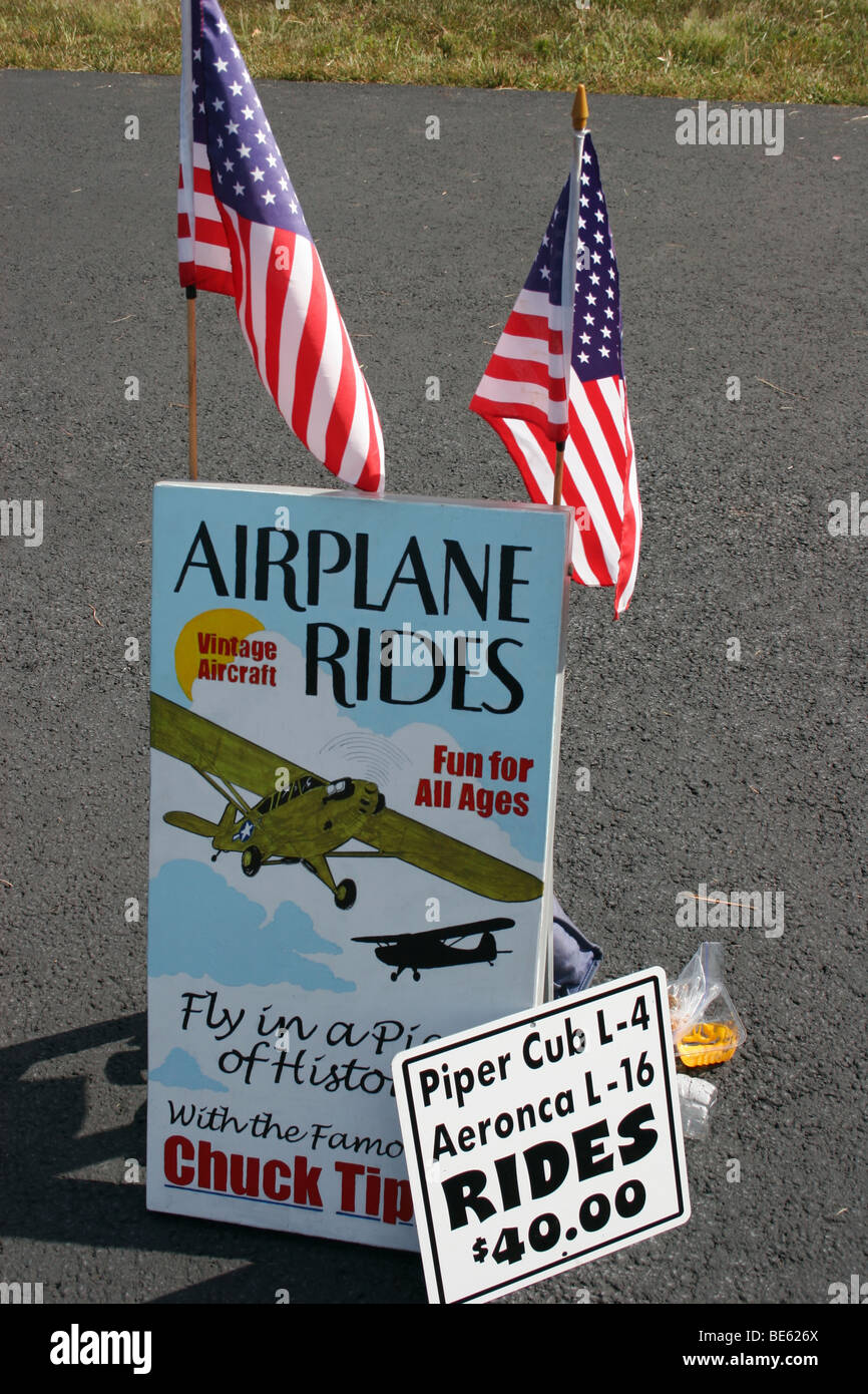 Sign advertising plane rides at airshow Stock Photo - Alamy
