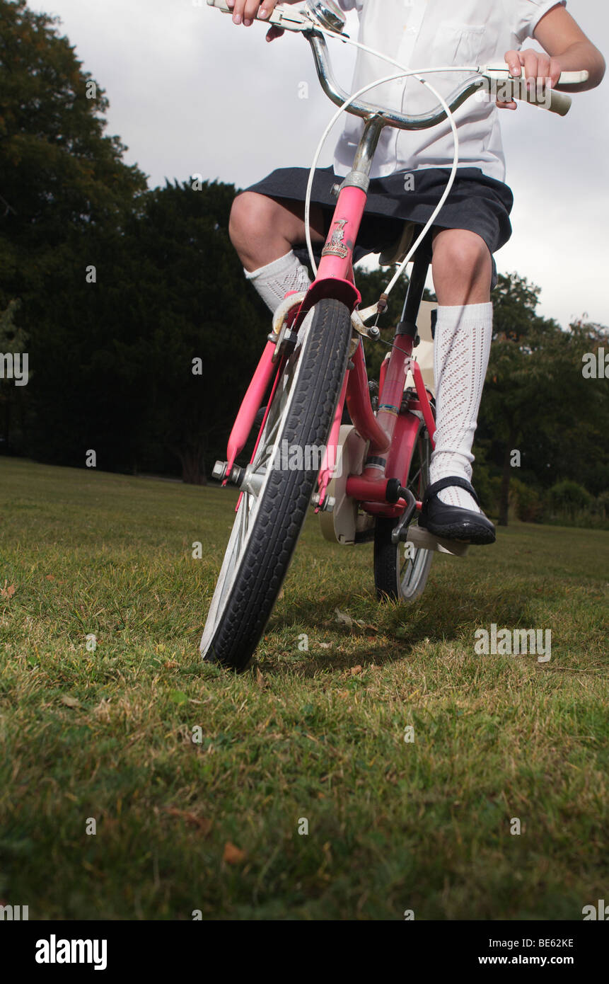 Child learning to ride a bicycle Stock Photo - Alamy