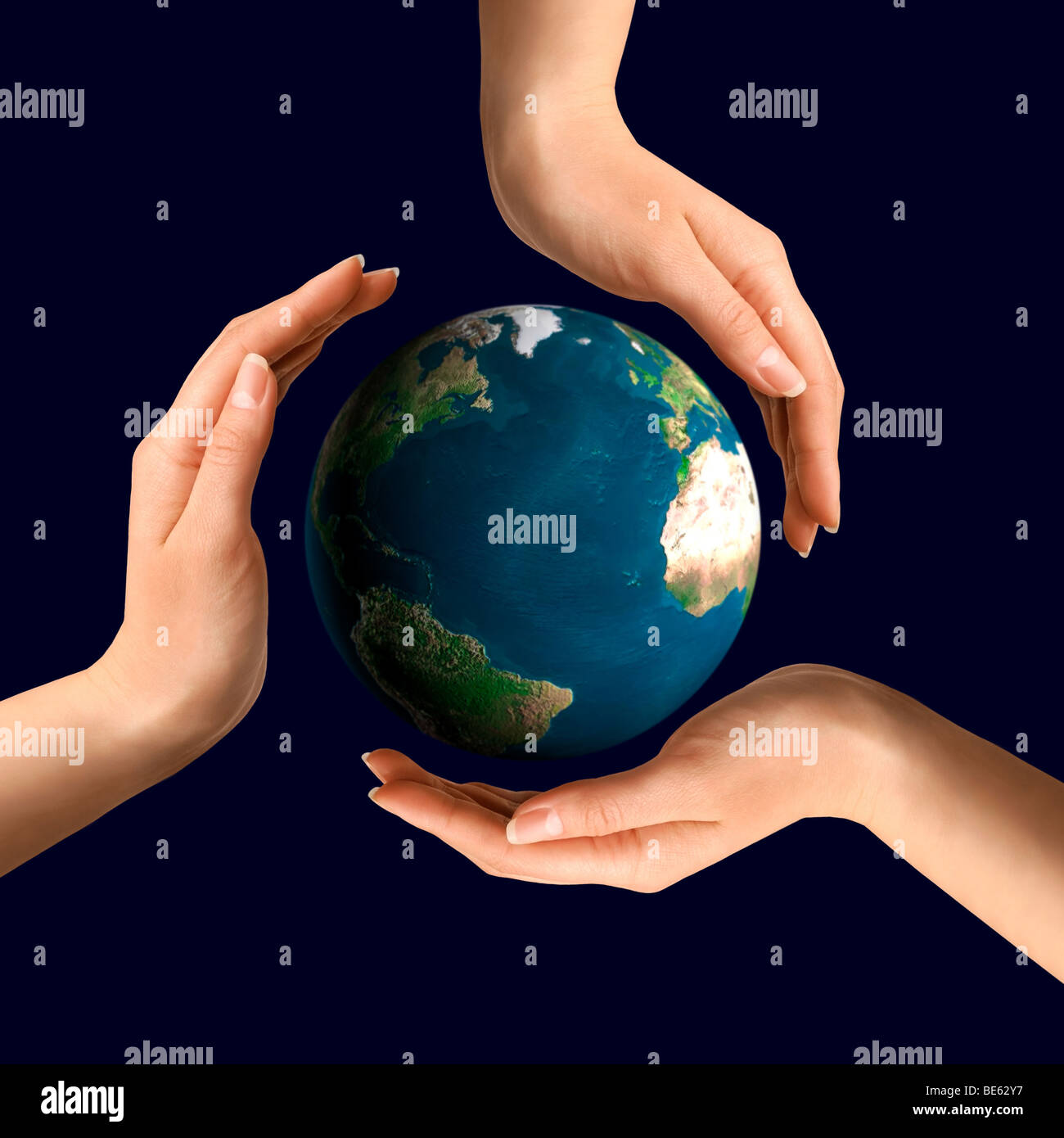 Conceptual recycling symbol made from hands over Earth Stock Photo - Alamy