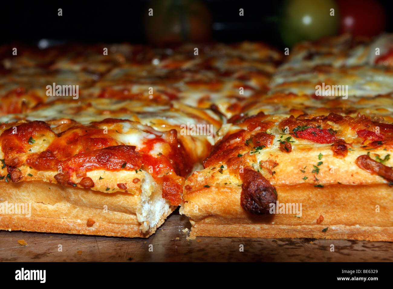 Freshly cooked pizza, sliced Stock Photo - Alamy