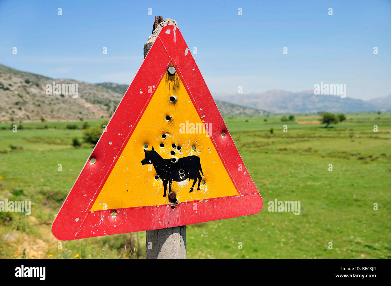 Traffic sign with bullet holes on the Lassithi Plateau, Eastern Crete ...